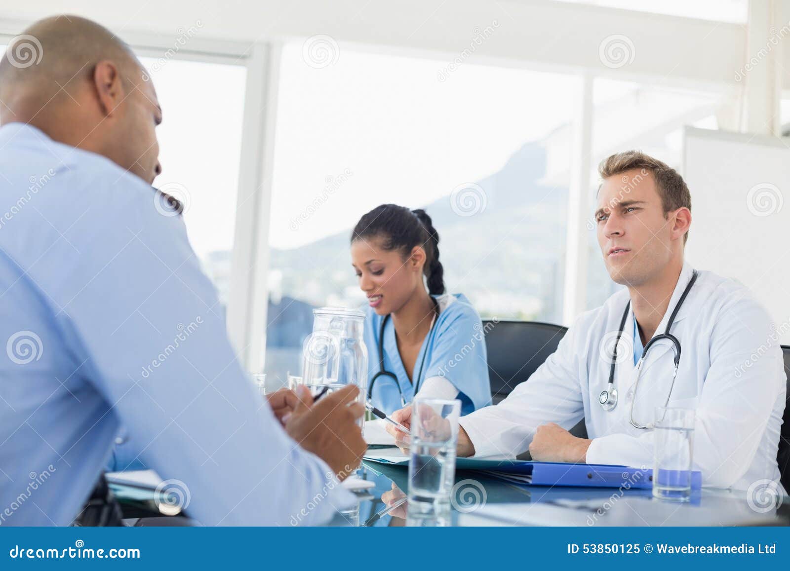 Team of Doctors Having a Meeting Stock Image - Image of clinic ...