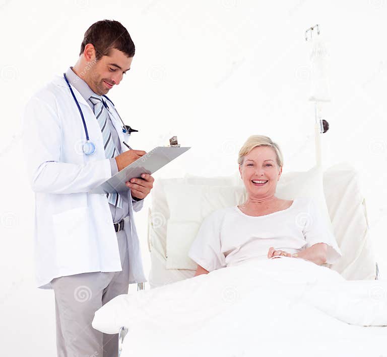 Team of Doctors Helping a Patient Stock Image - Image of human, happy ...