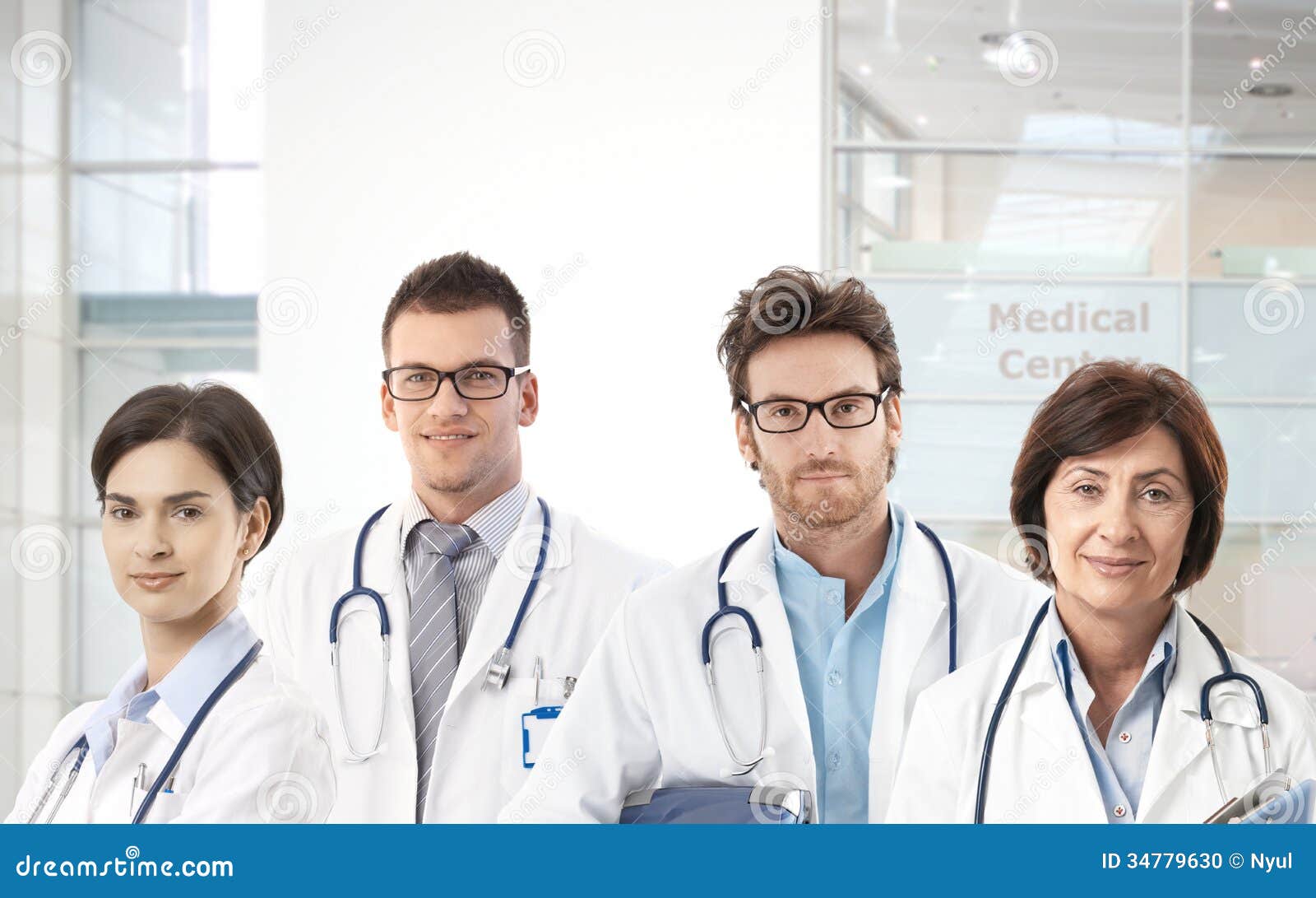 Team of Doctors in Hospital Lobby Stock Photo - Image of happy, camera ...