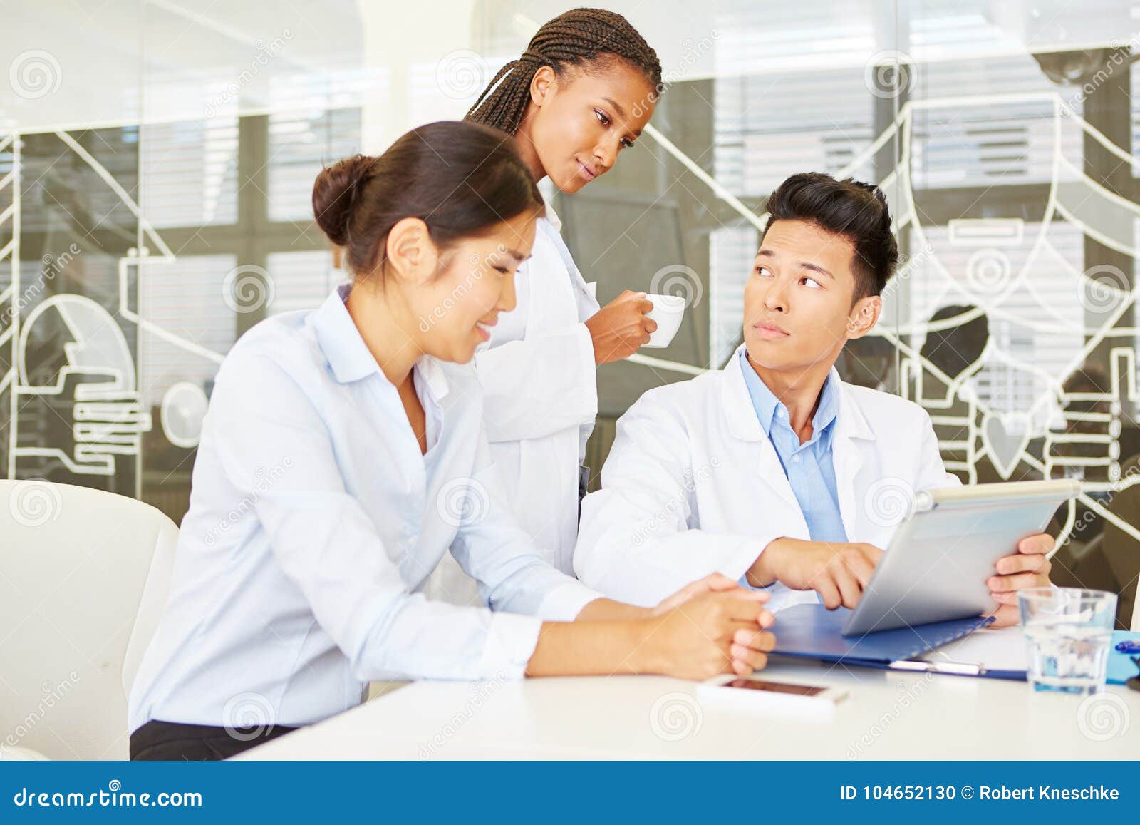 Team of doctors in meeting stock photo. Image of colleagues - 104652130