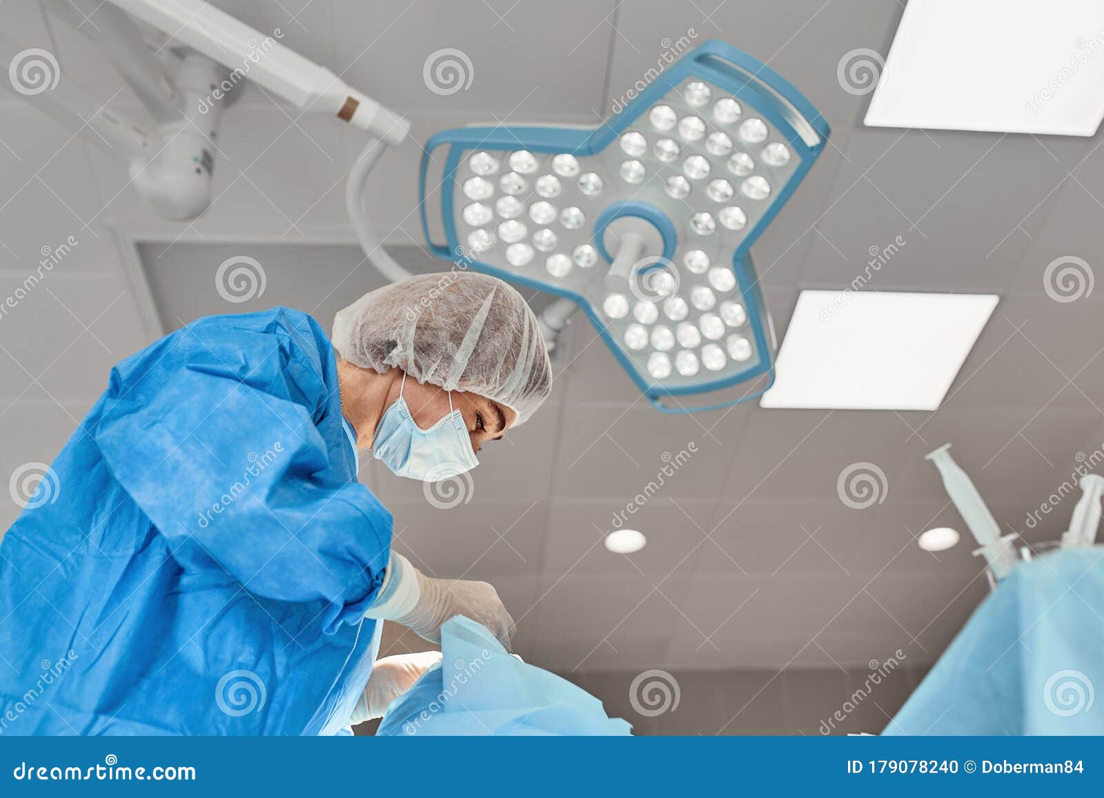 A Team of Doctors Performs an Operation. a Group of Surgeons at Work in ...