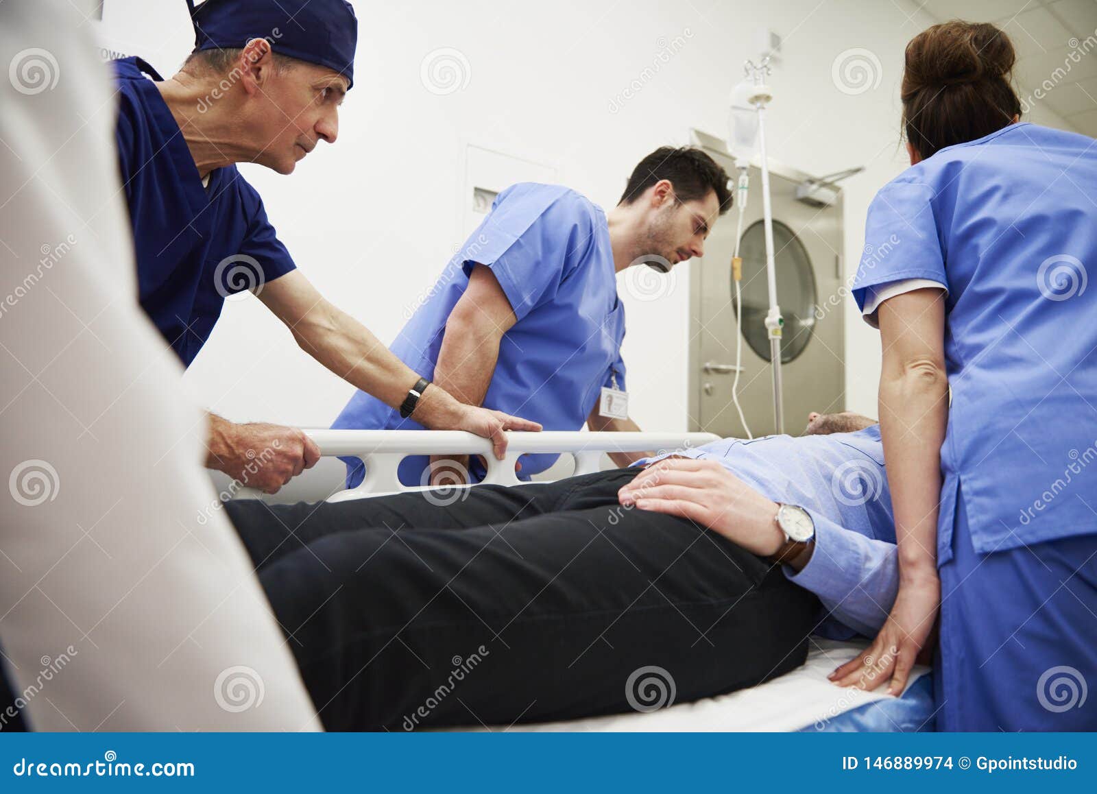 Side View of Doctors Running To the Operating Room Stock Photo - Image ...