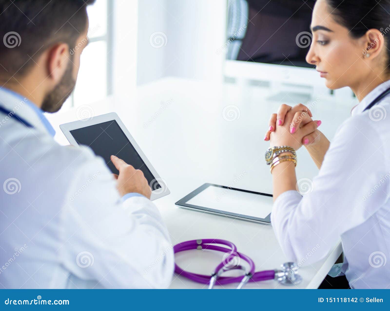 Team of Doctors Sitting at Table in Clinic Stock Photo - Image of ...