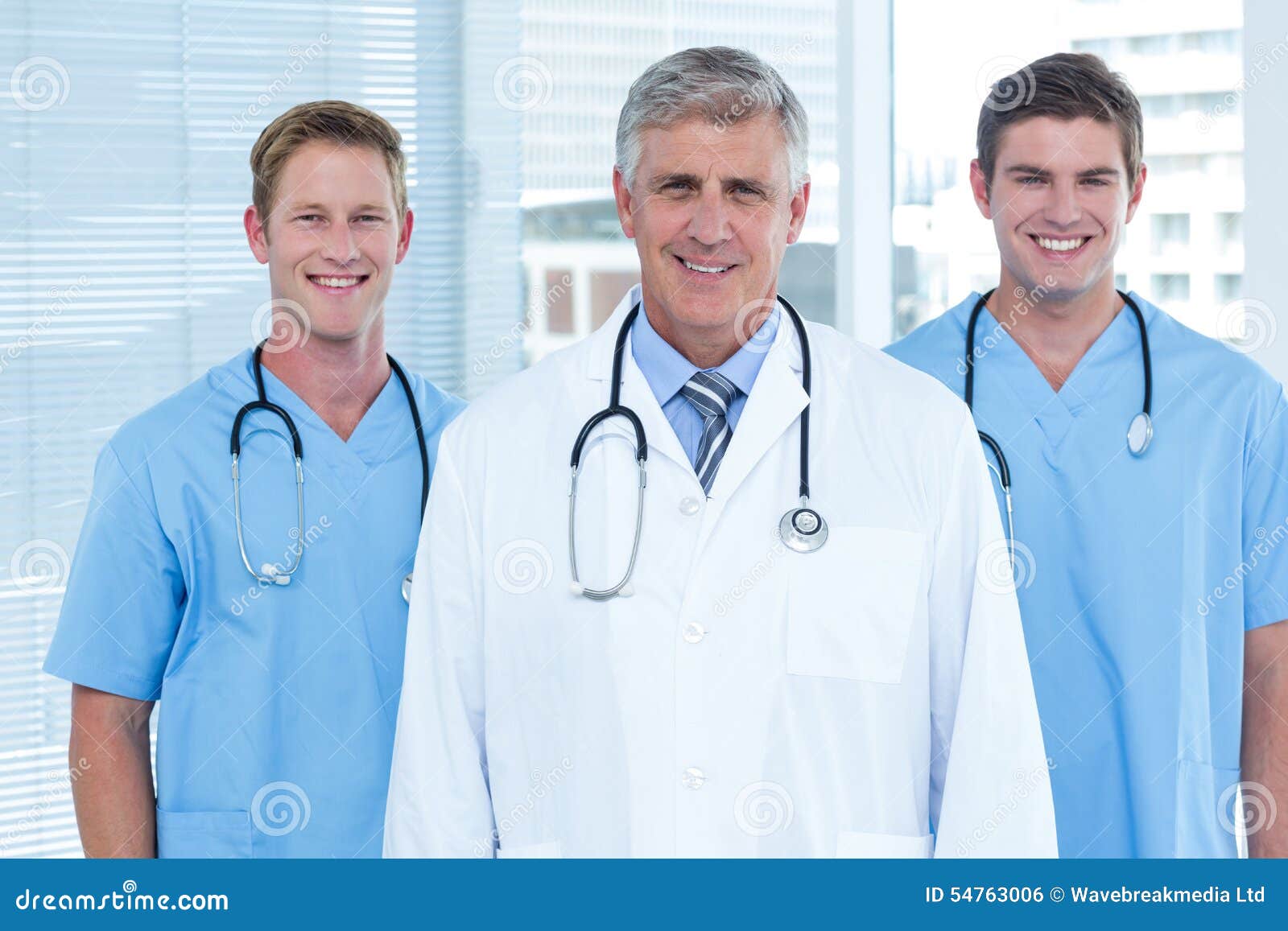 Team of Doctors Smiling at Camera Stock Photo - Image of mature, happy ...