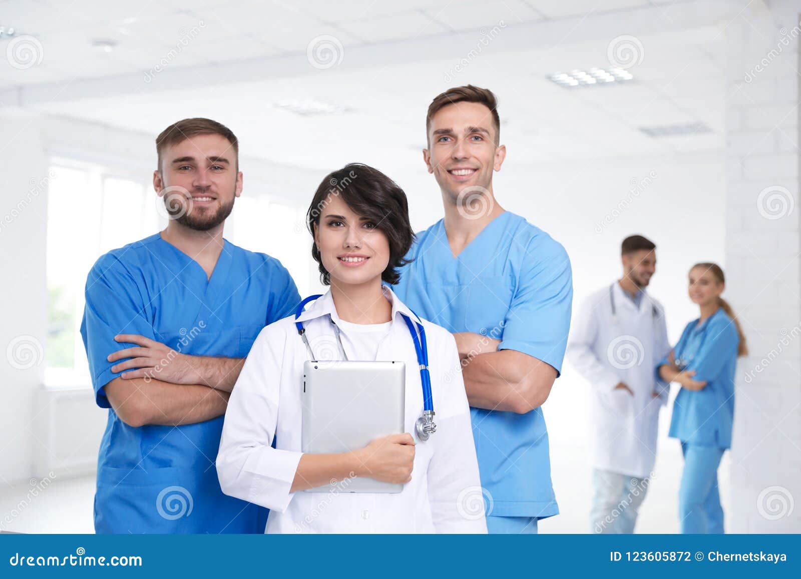 Team of Doctors with Tablet Stock Photo - Image of male, medic: 123605872