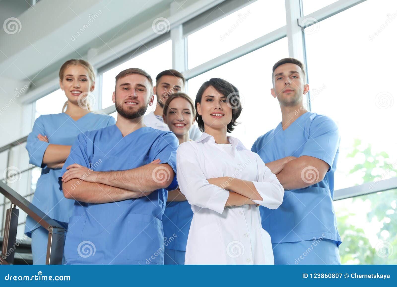 Team of doctors in uniform stock image. Image of care - 123860807