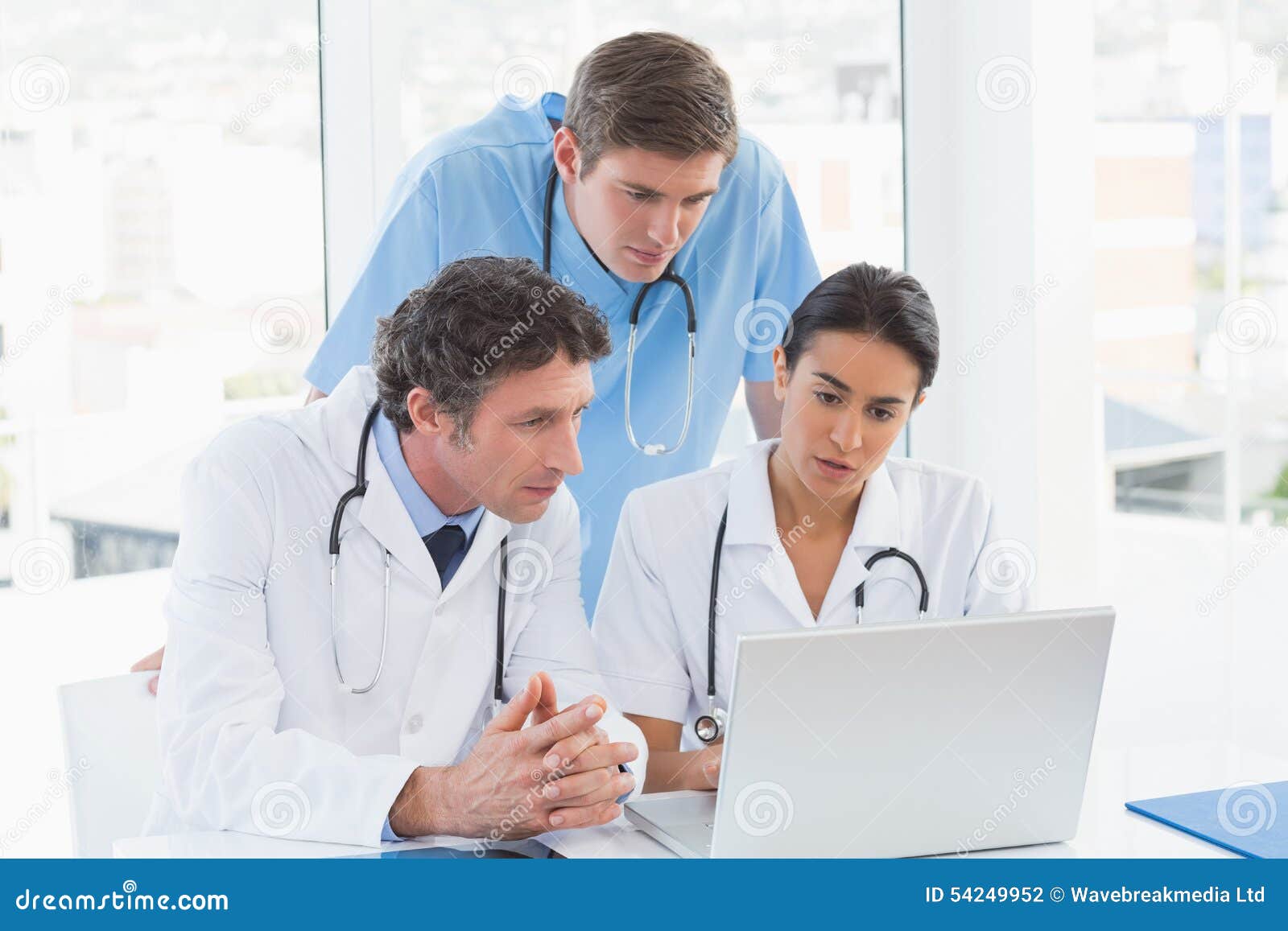 Team of Doctors Working on Laptop Computer Stock Photo - Image of adult ...