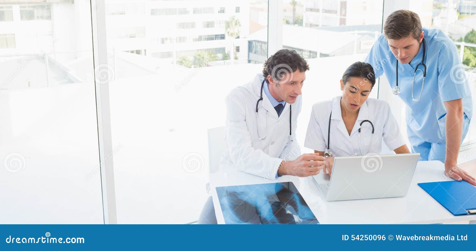 Team of Doctors Working on Laptop Computer Stock Photo - Image of ...