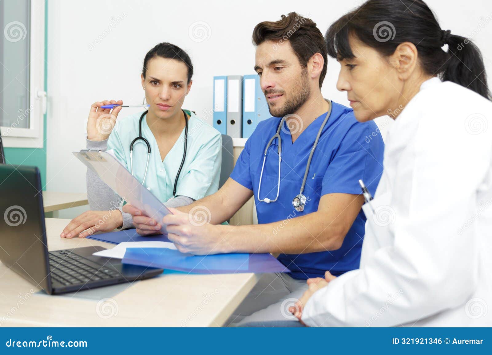 Team Doctors Working on Laptop in Medical Office Stock Photo - Image of ...