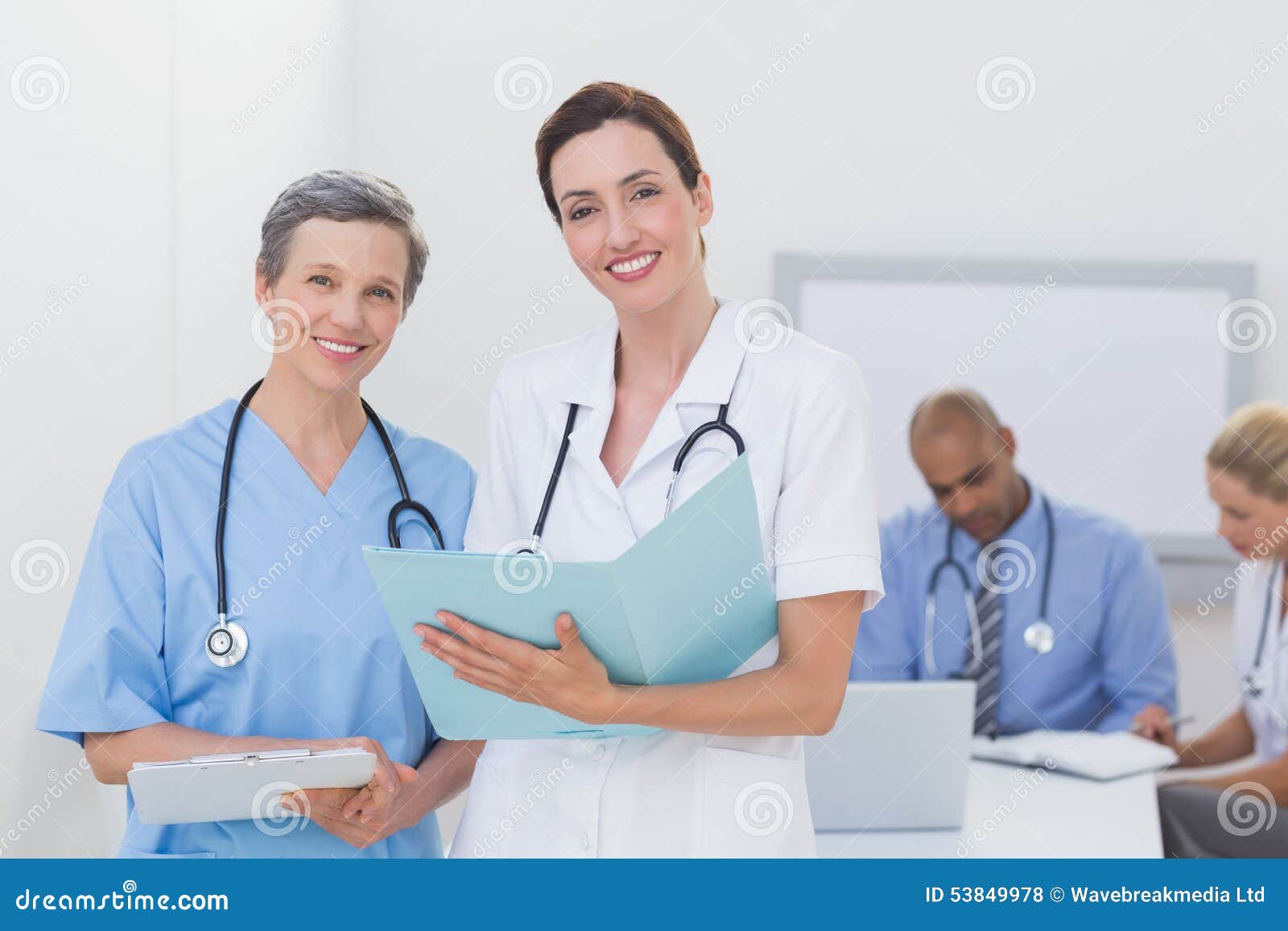Team of Doctors Working on Their Files Stock Photo - Image of holding ...