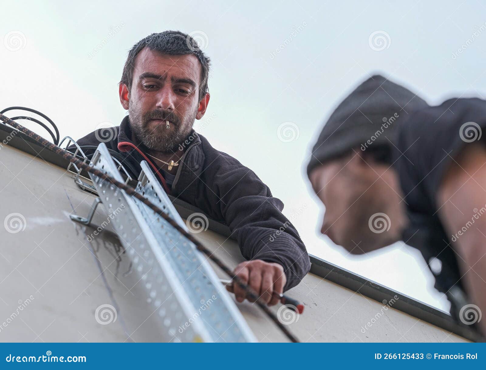 Team of Electrical Engineers Install the Electrical Cables for the ...