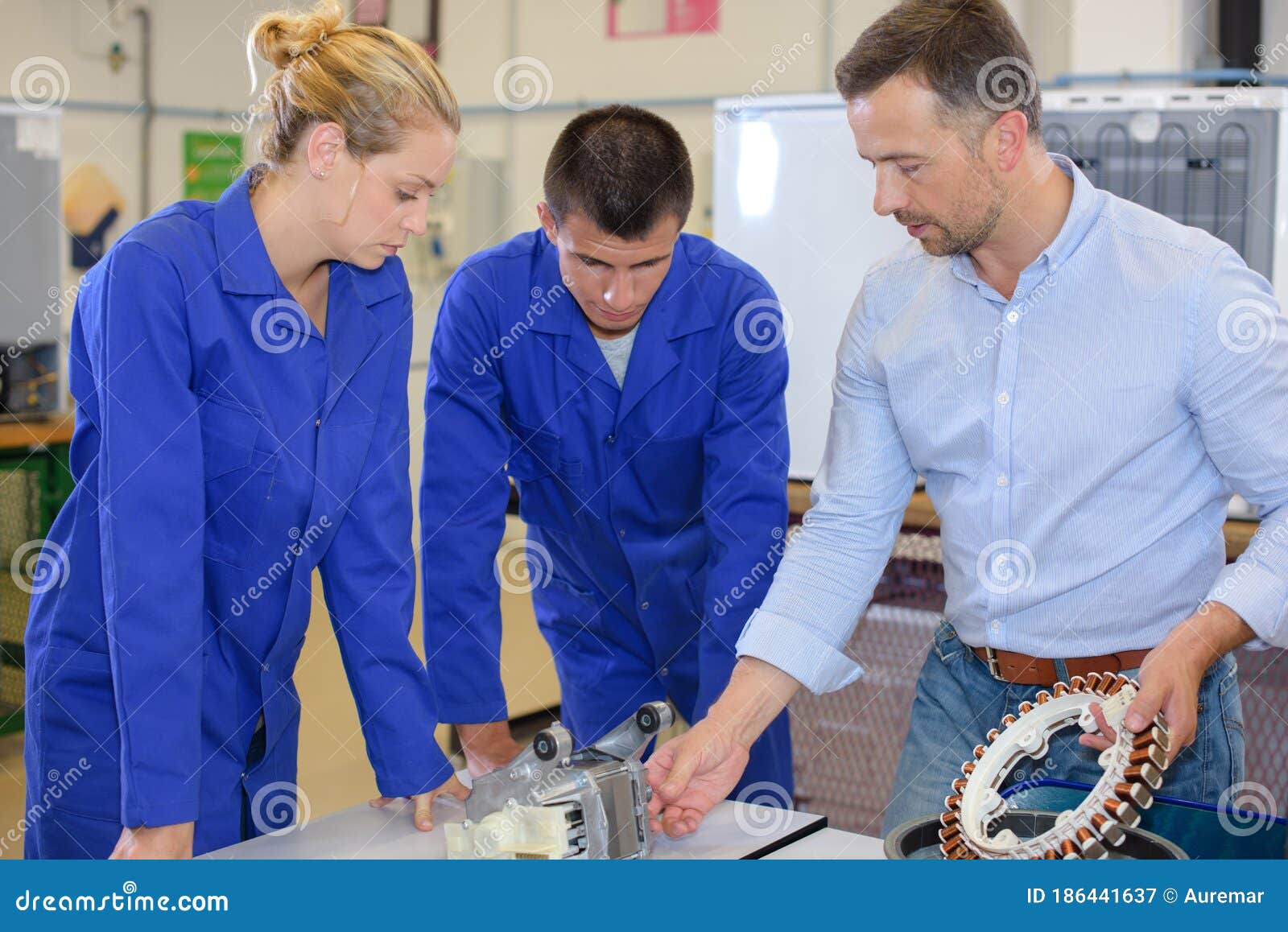 Team Electronic Apprentices Assembling Machine Stock Image - Image of ...