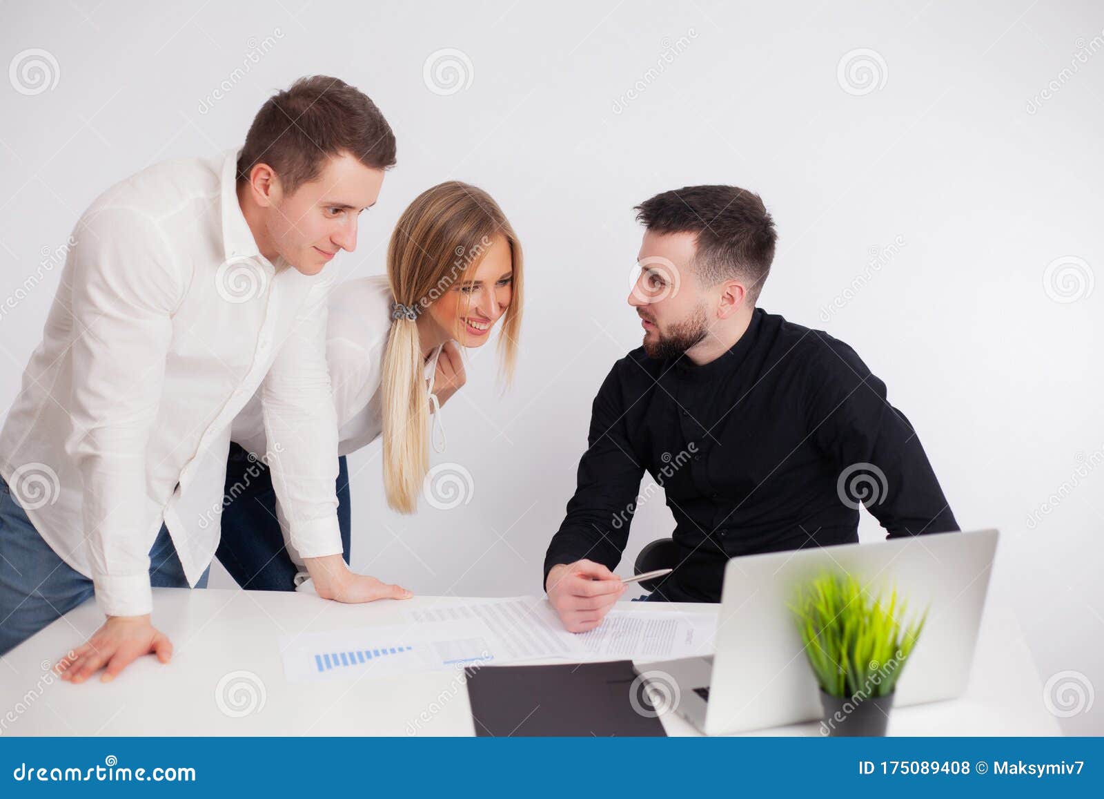 Team of Employees Working Together on a Joint Project Stock Photo ...