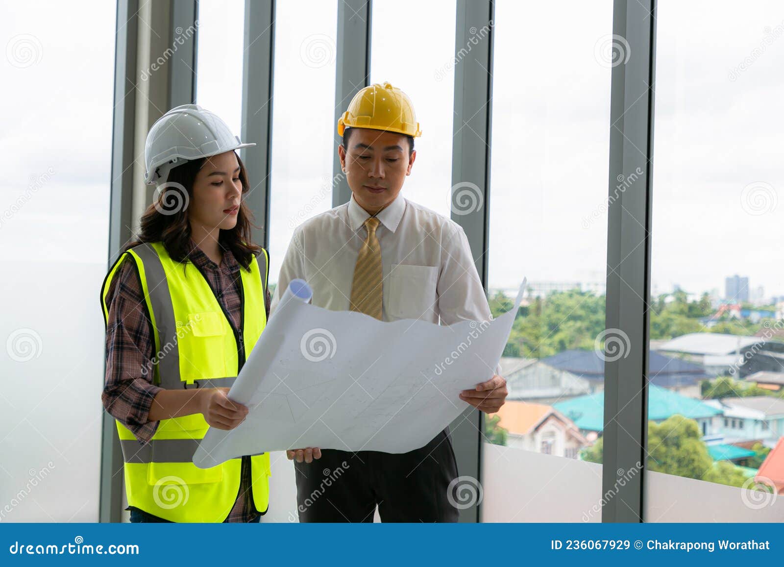 Team of Engineers Architects Working and Standing Around Table Working ...