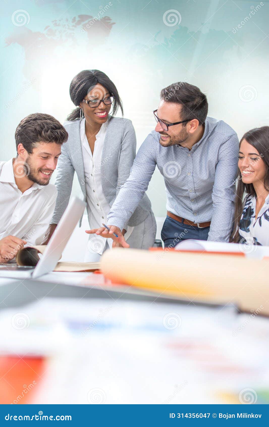 Team of Engineers Discussing Blueprint at Meeting in Modern Office ...