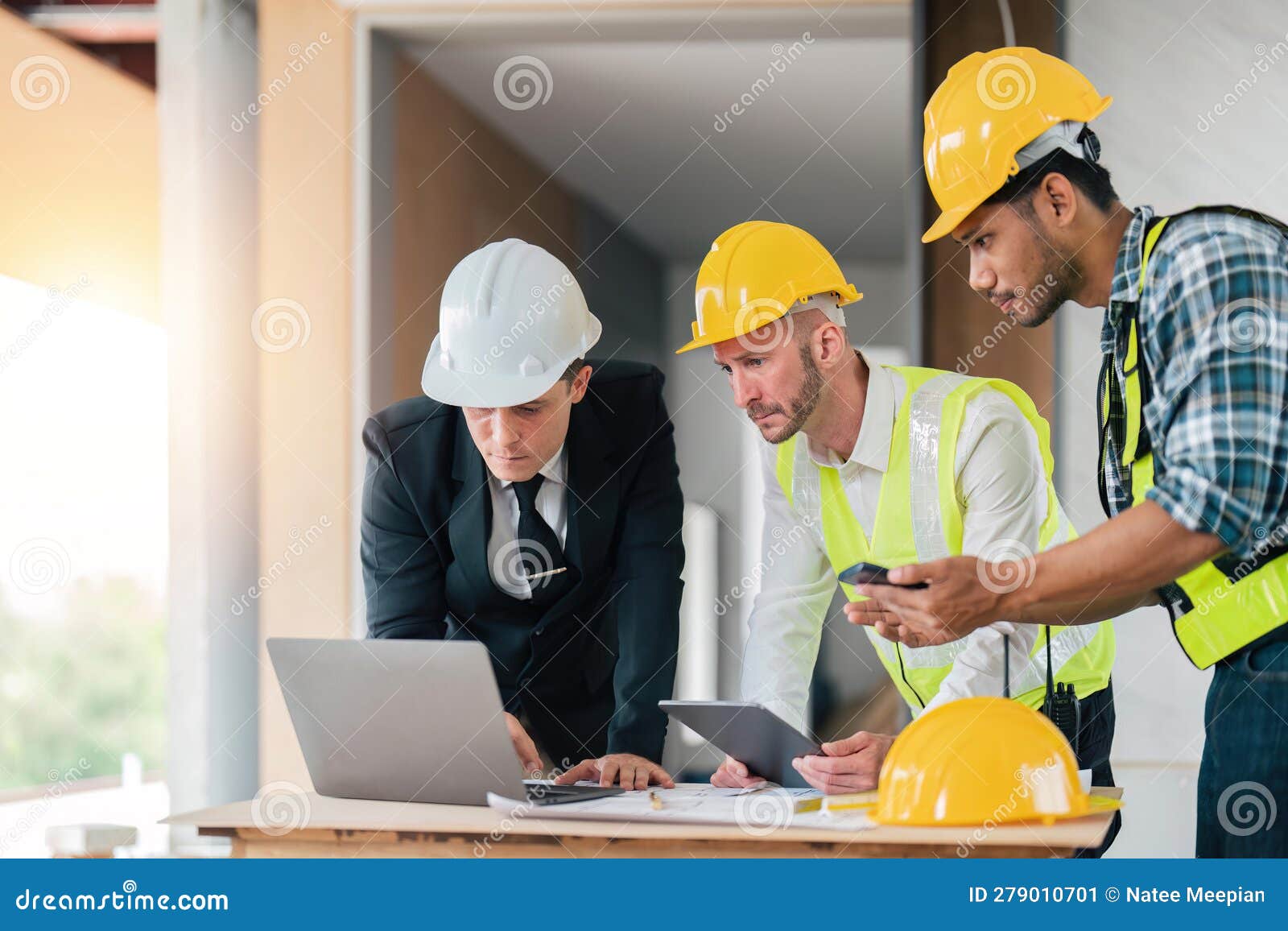 Team Engineers with Draft Plan of Building on Constructing Site ...