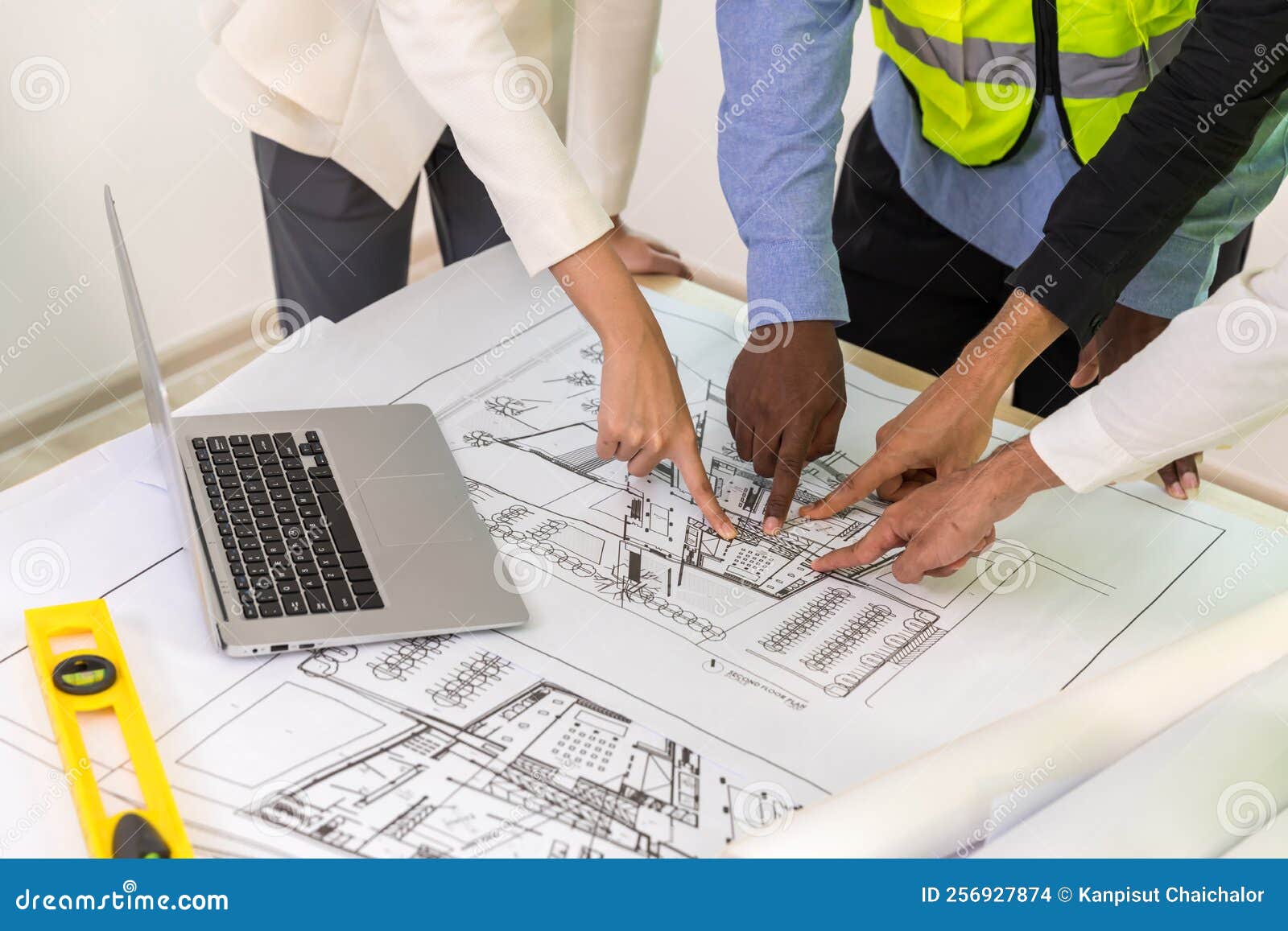 Team Engineers with Draft Plan of Building on Constructing Site. Stock ...