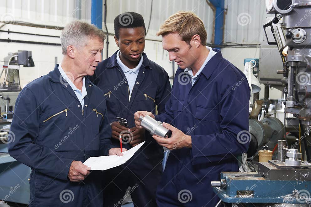 Team of Engineers Having Discussion in Factory Stock Image - Image of ...