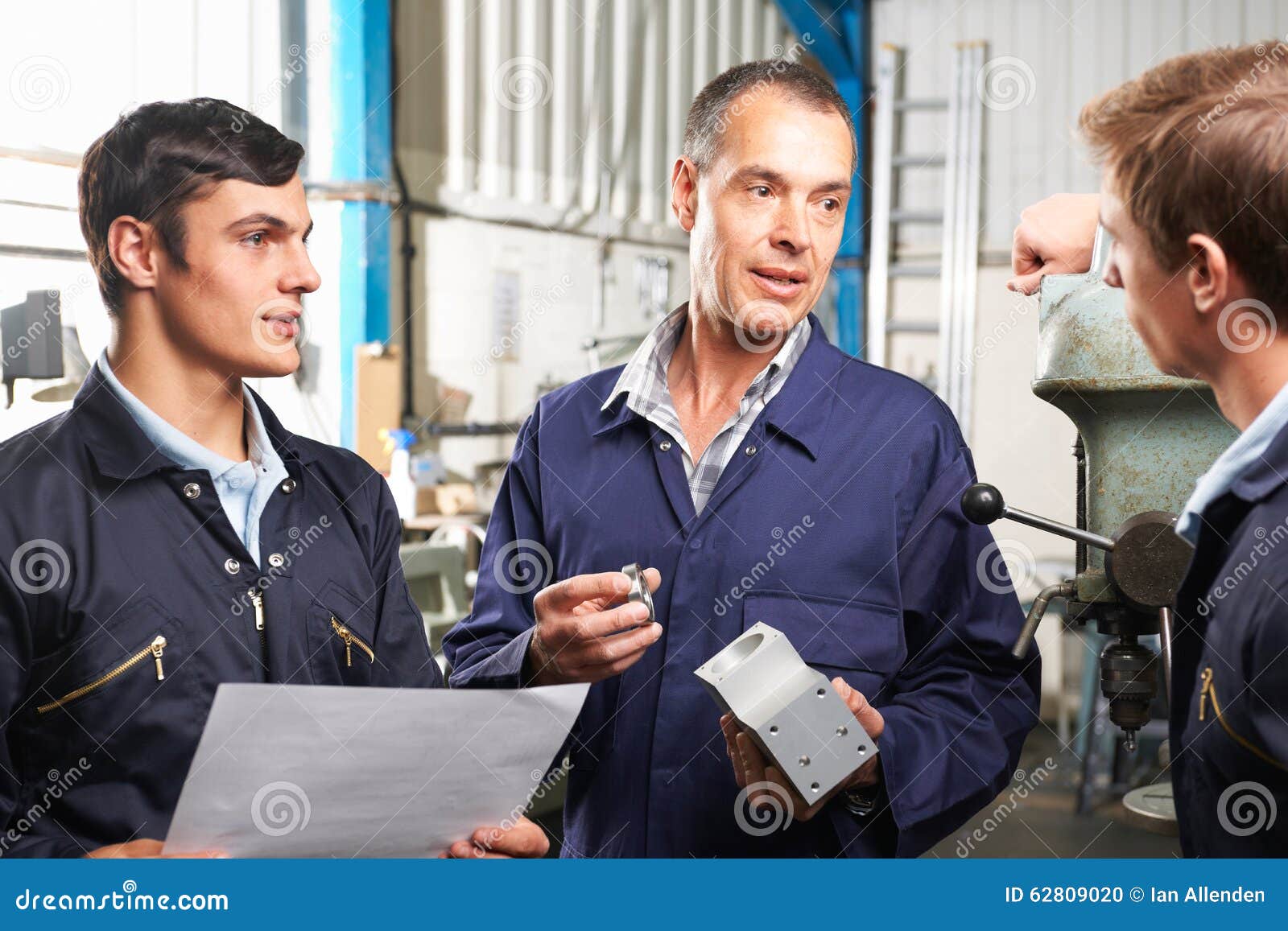 Team of Engineers Having Discussion in Factory Stock Photo - Image of ...