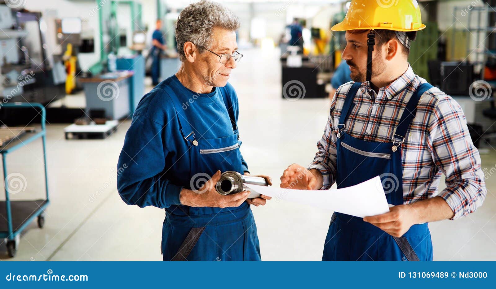 Team of Engineers Having Discussion in Factory Stock Image - Image of ...