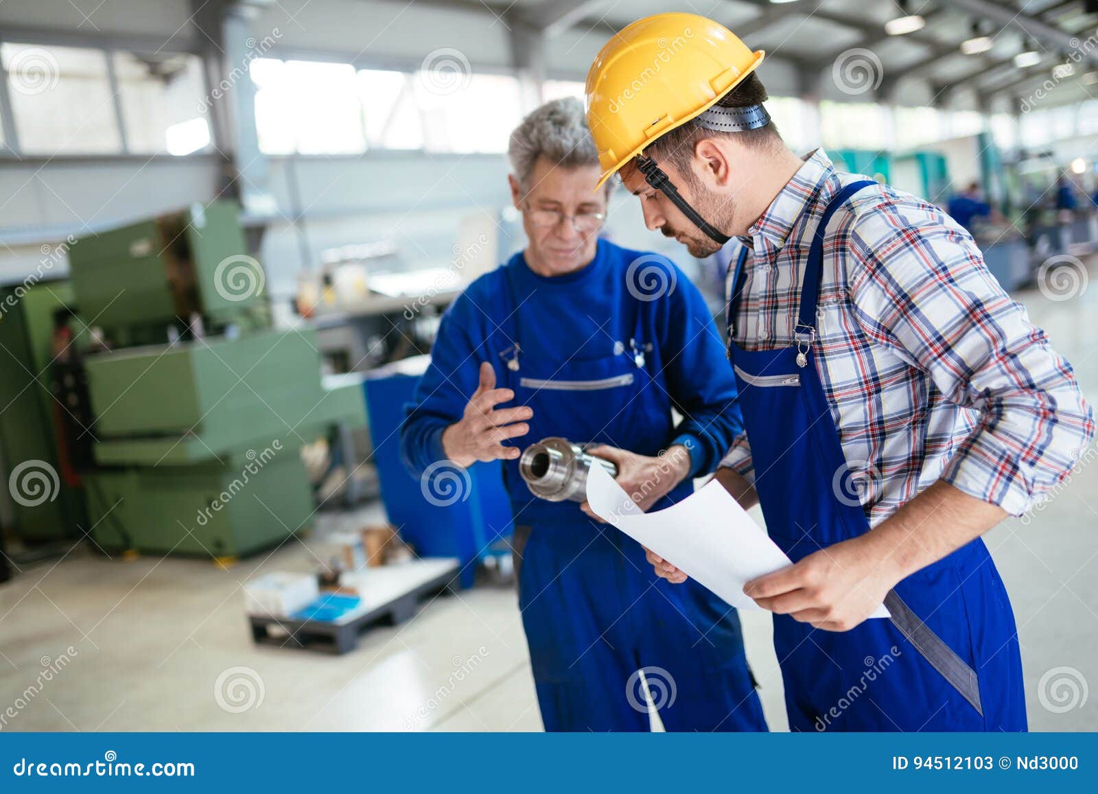 Team of Engineers Having Discussion in Factory Stock Image - Image of ...