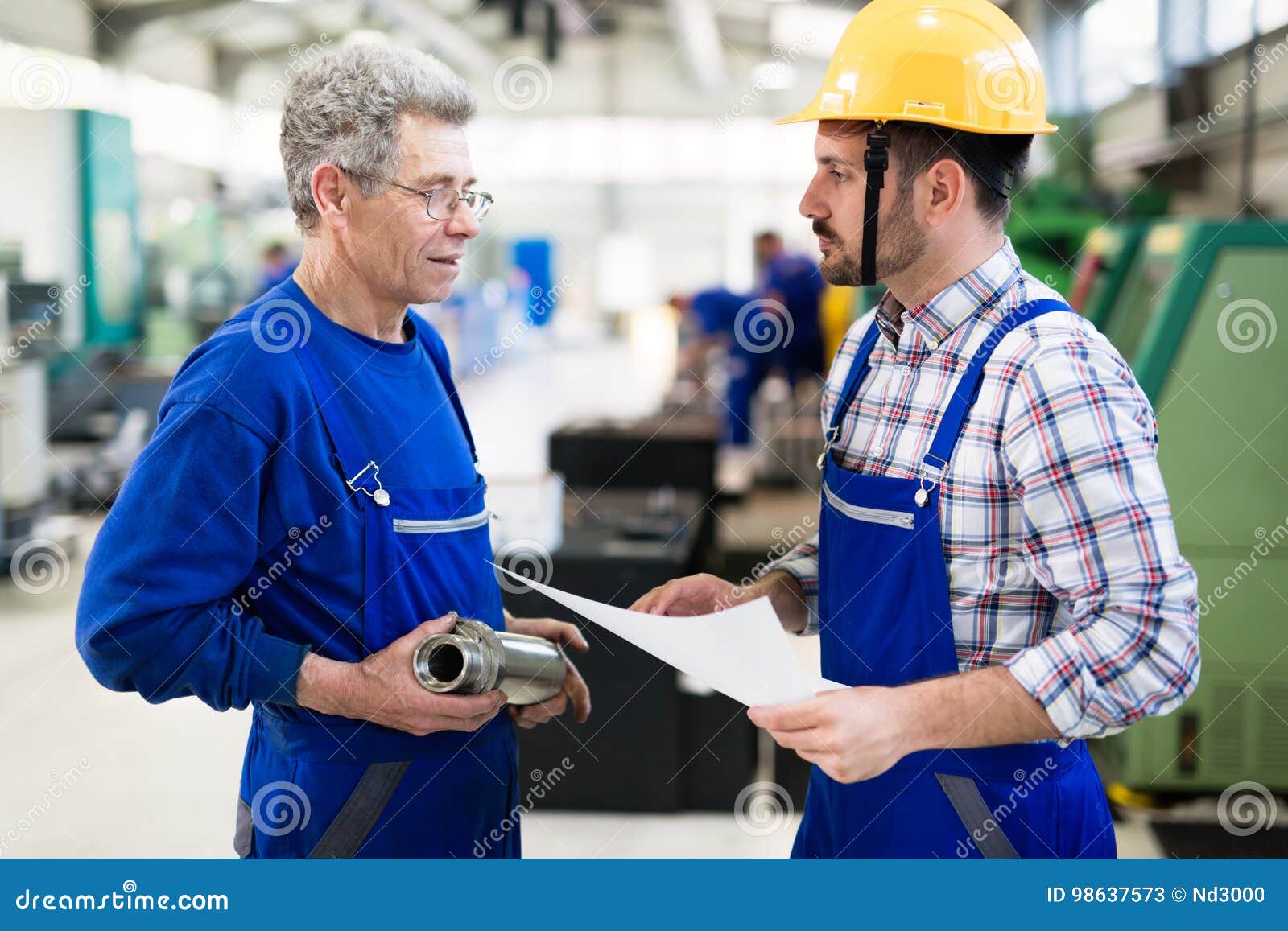 Team of Engineers Having Discussion in Factory Stock Image - Image of ...
