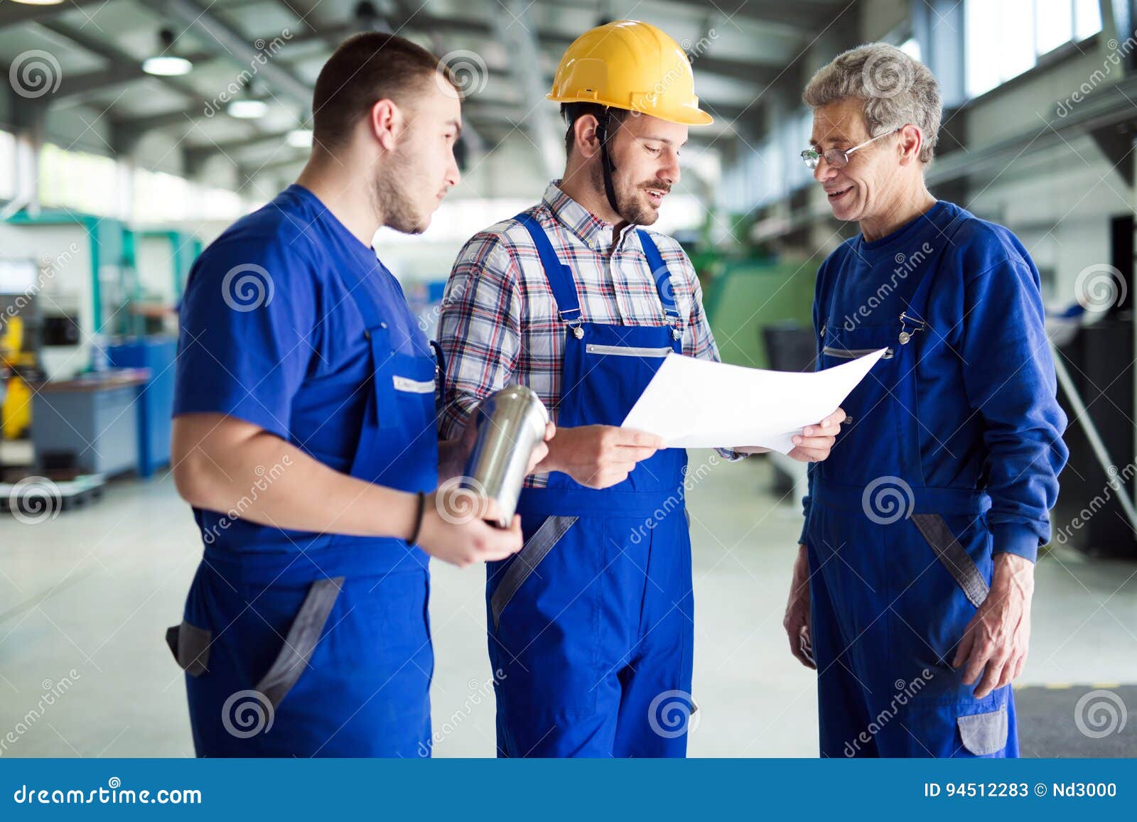 Team of Engineers Having Discussion in Factory Stock Image - Image of ...