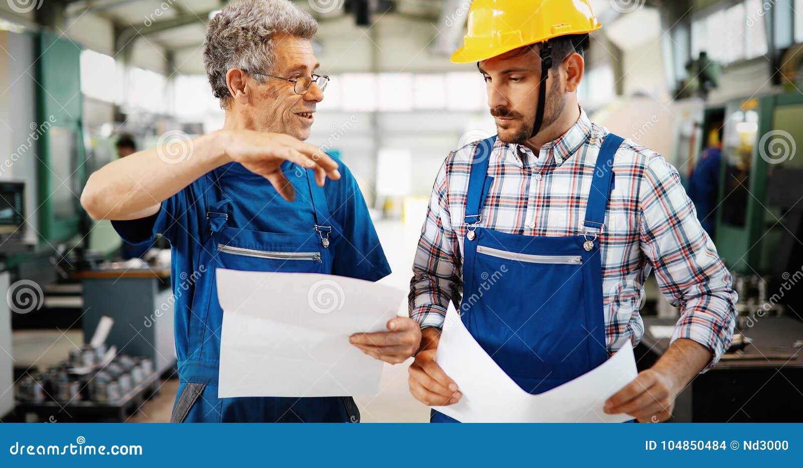 Team of Engineers Having Discussion in Factory Stock Photo - Image of ...