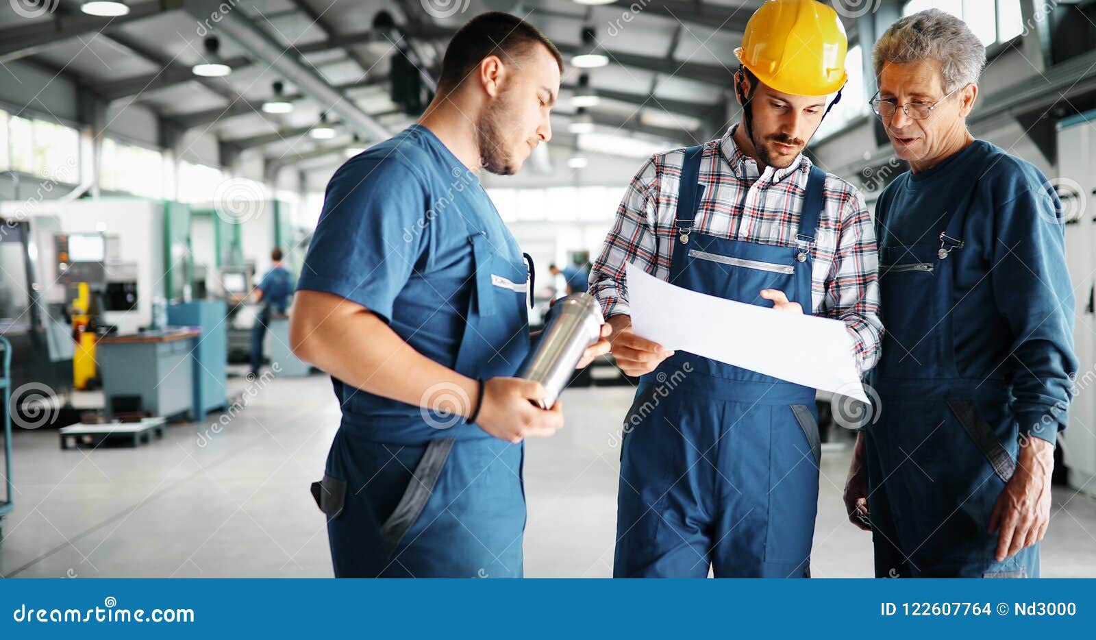 Team of Engineers Having Discussion in Factory Stock Photo - Image of ...