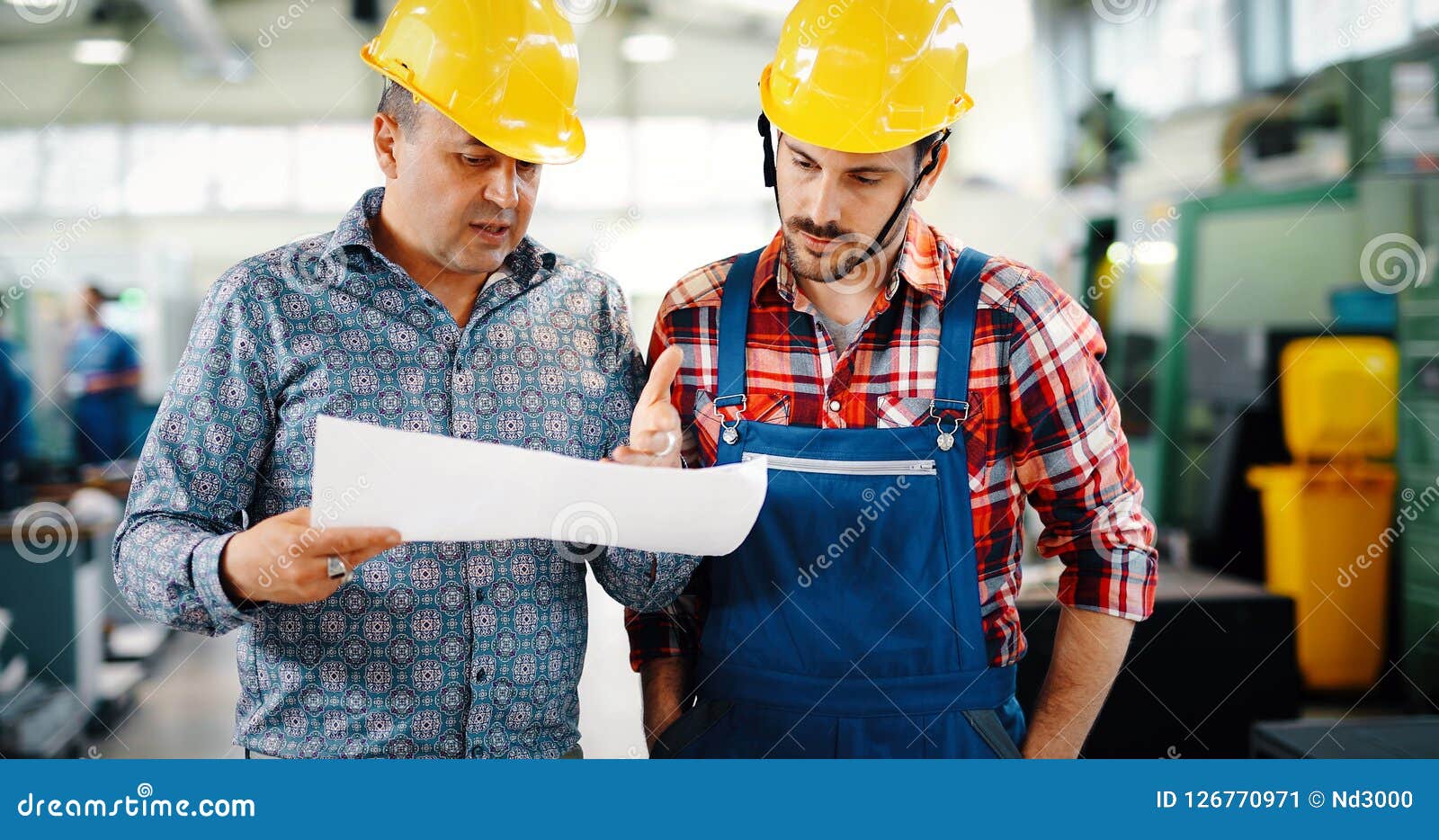 Team of Engineers Having Discussion in Factory Stock Image - Image of ...