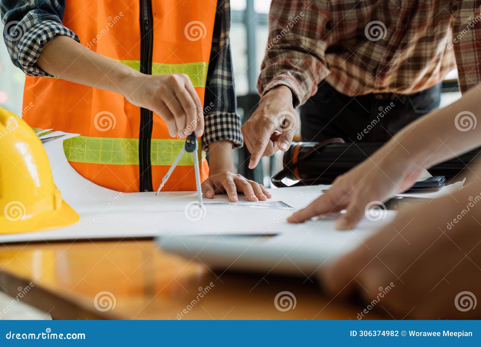 Team of Engineers Reviewing Blueprints Sketch of a New Construction ...
