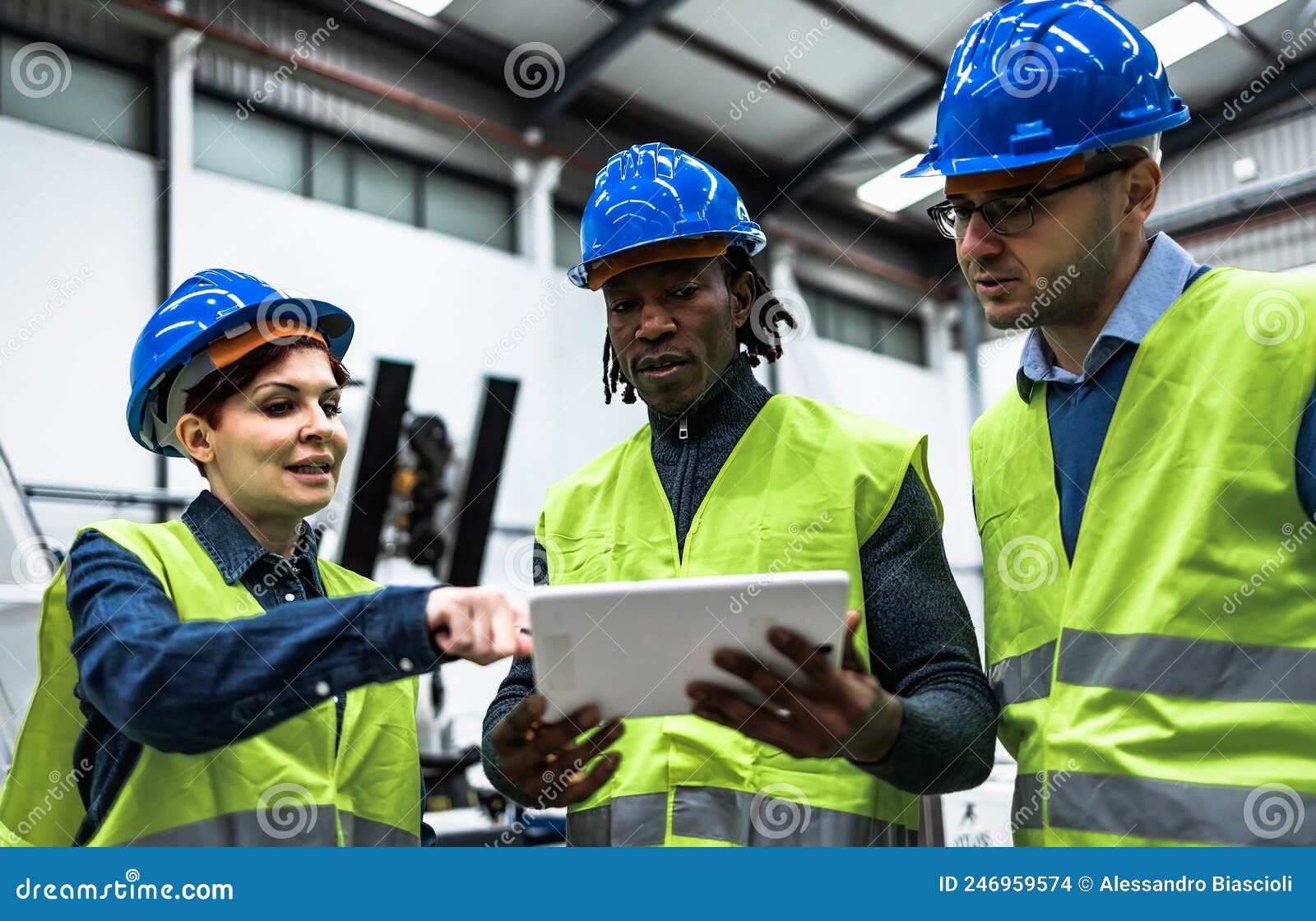 Team of Engineers Working in Robotic Factory while Analyzing the ...
