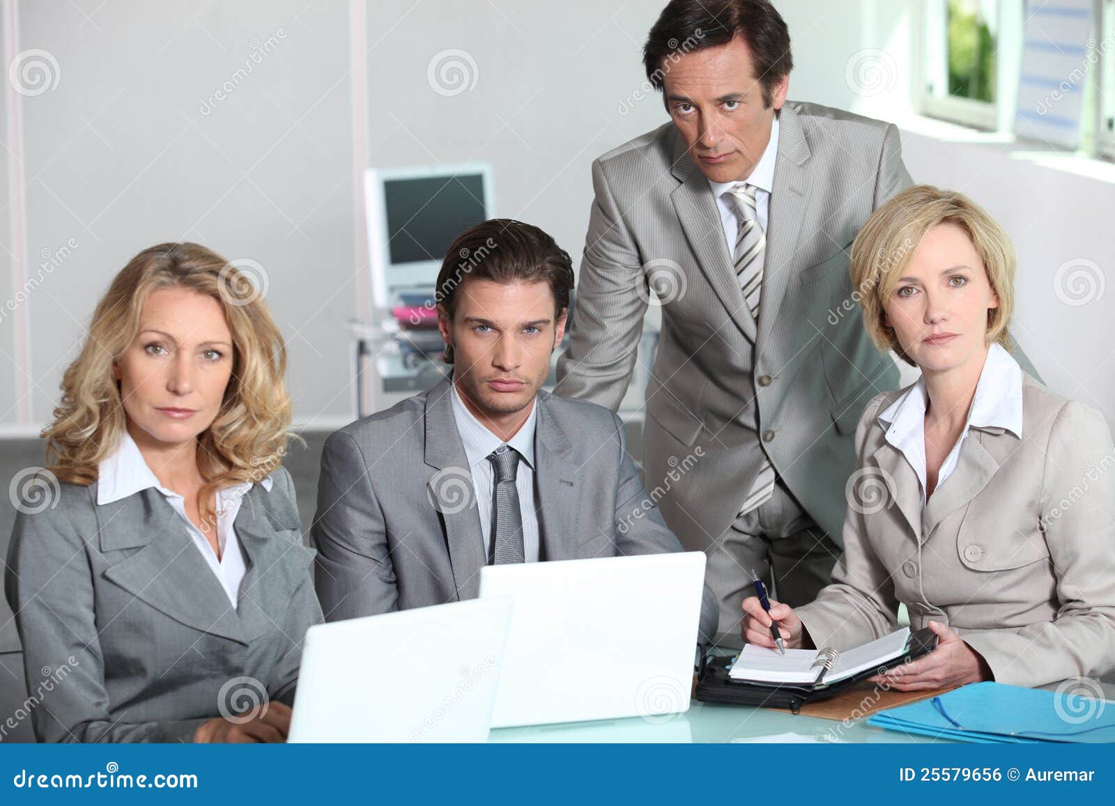 Team of executives stock photo. Image of indoors, front - 25579656