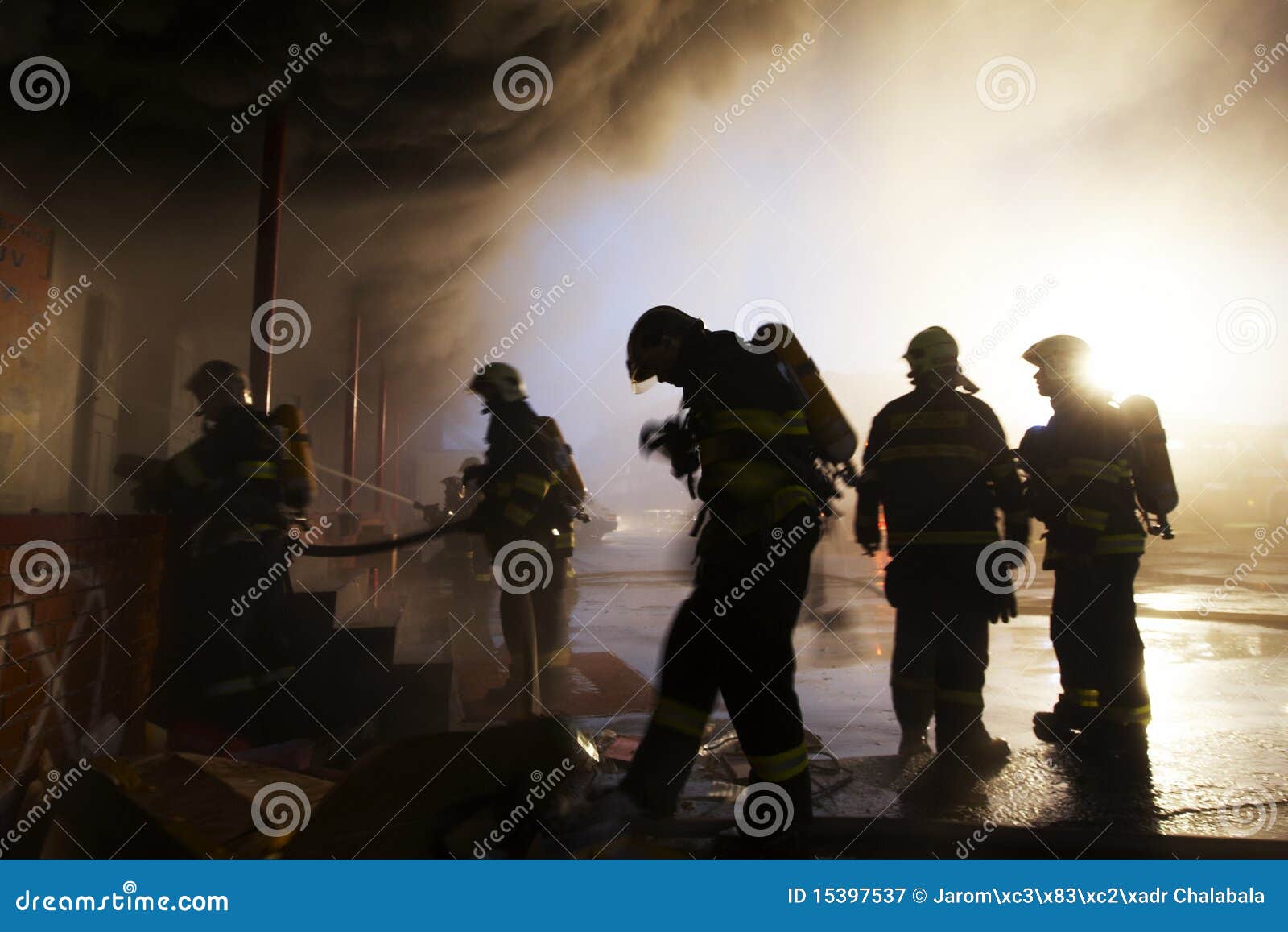 The Team of Firemen Fighting with the Fire Stock Image - Image of ...
