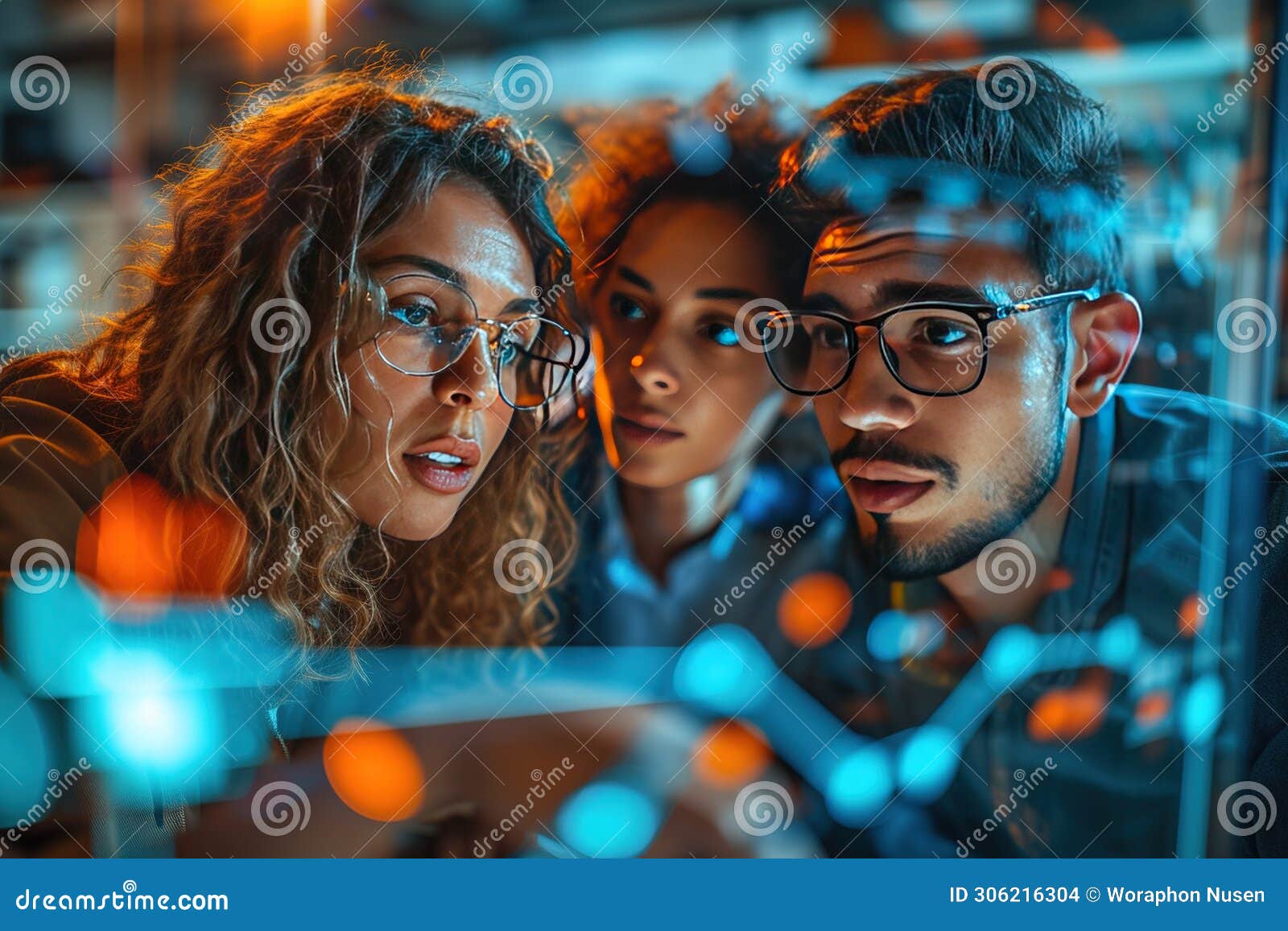 A Team of Focused Scientists Studying Molecular Models, Analyzing ...