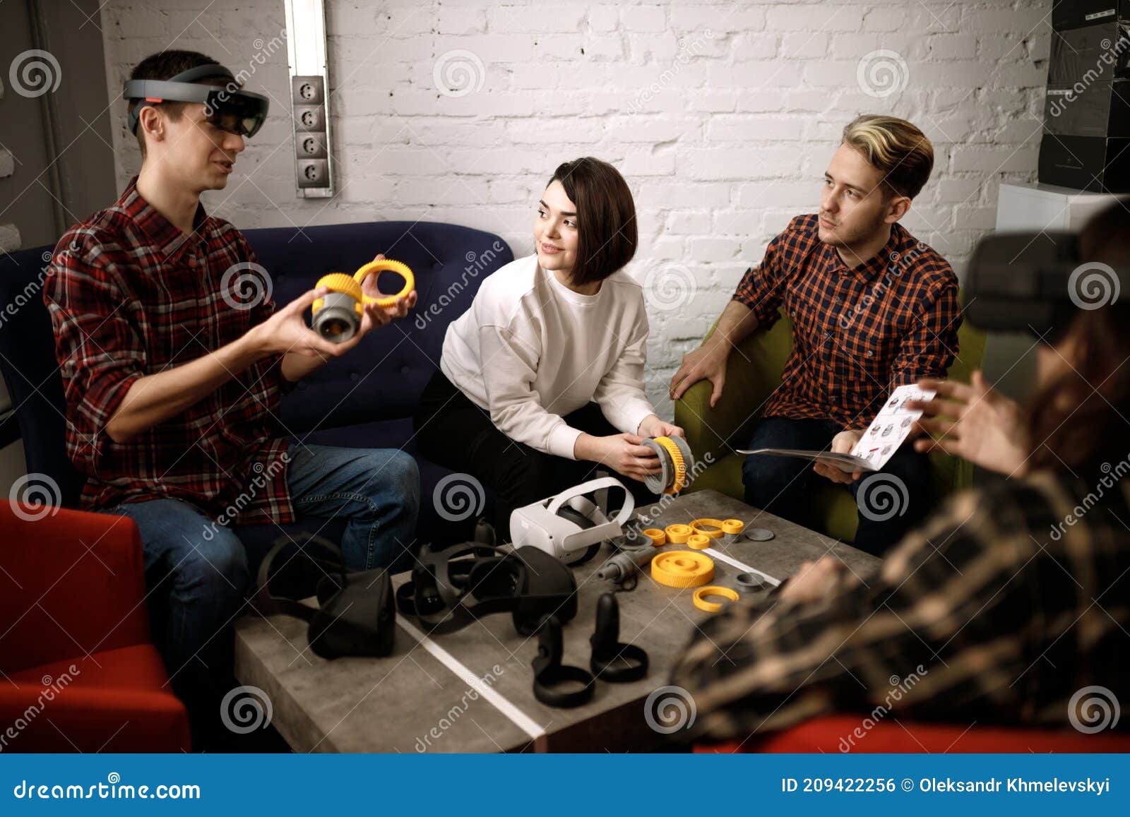 Team of Four Creative Engineers Working with Virtual Reality, Young ... Team of Four Creative Engineers Working with Virtual Reality, Young ...