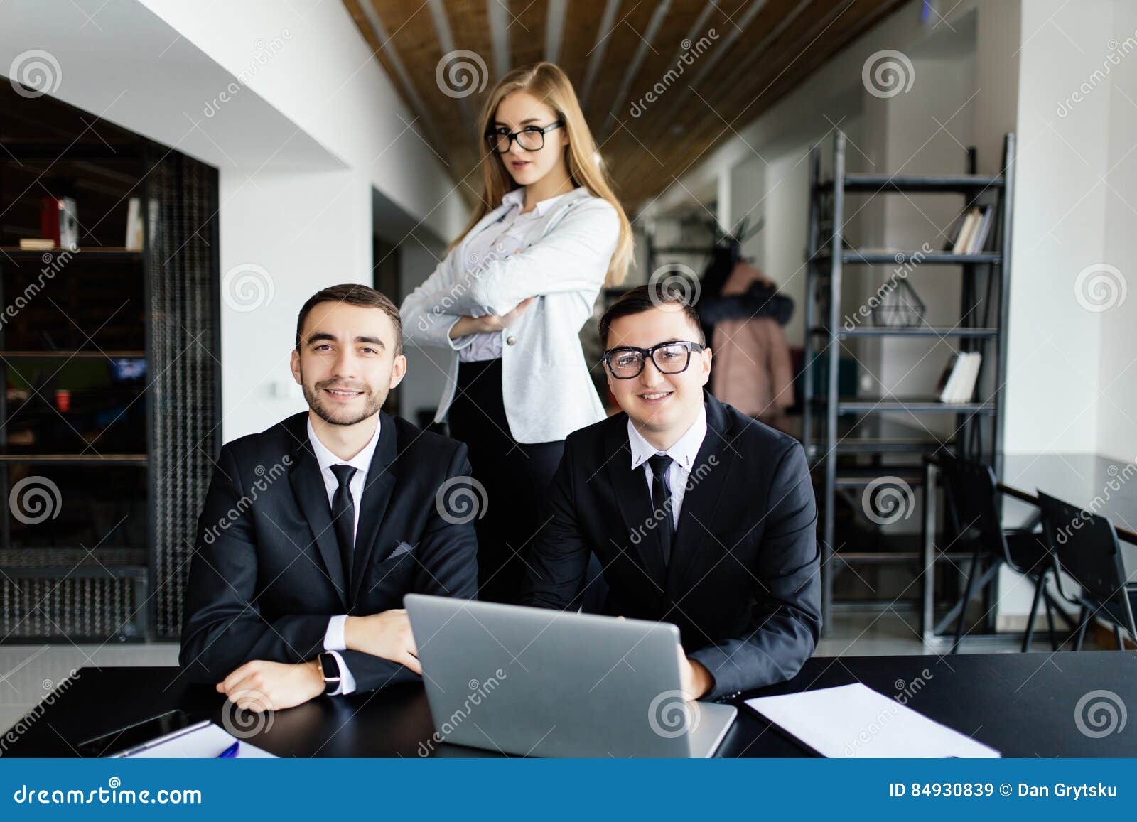 Team gathering at desk stock image. Image of computer - 84930839