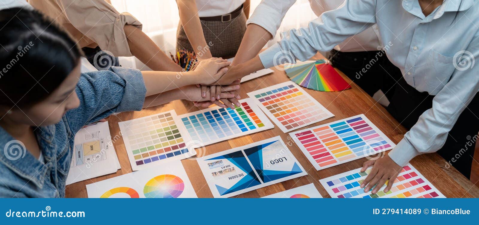 Team of Graphic Designers Building Unity and Solidarity. Scrutinize ...