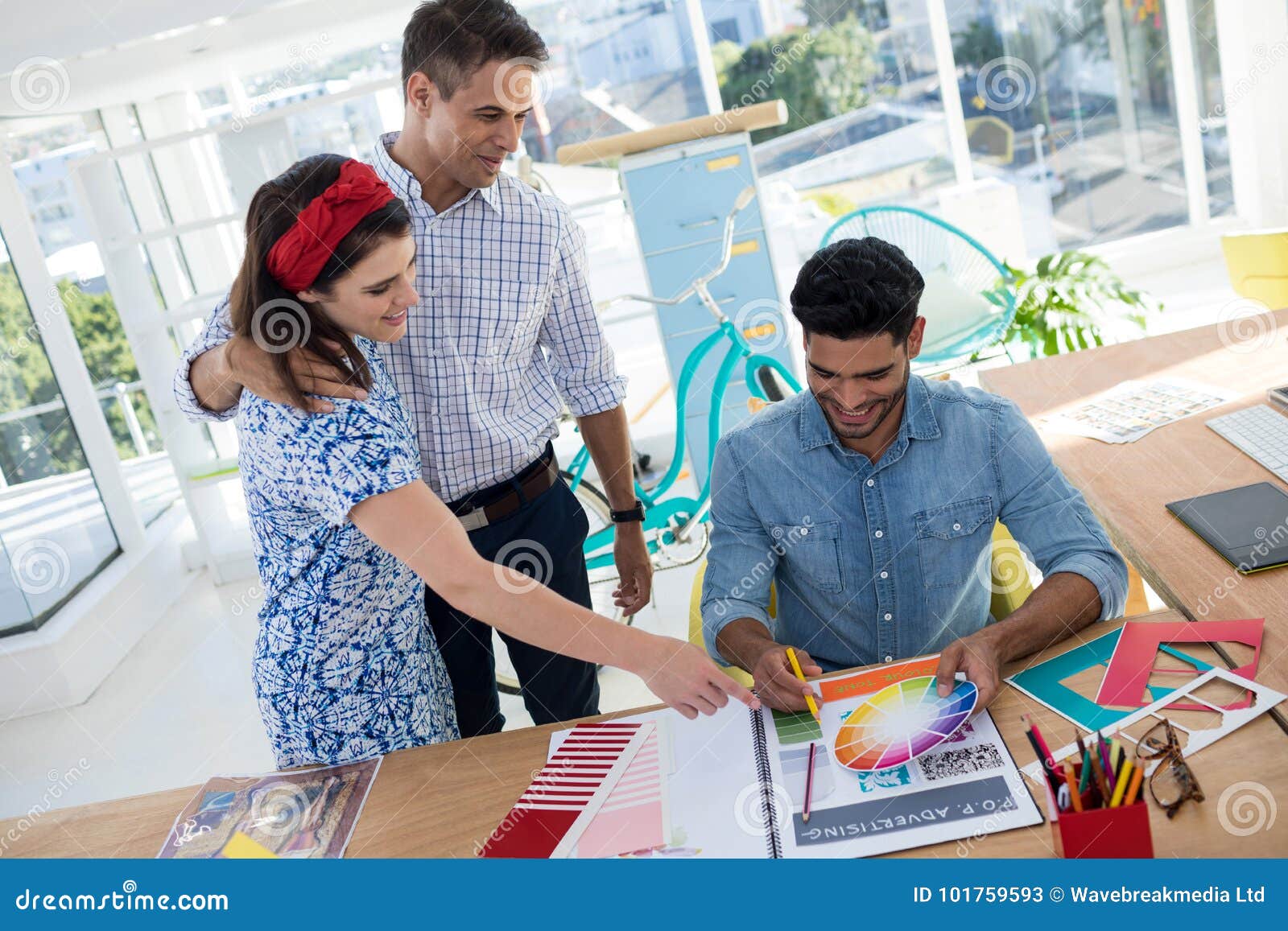 Team of Graphic Designers Discussing Over Document Stock Image - Image ...