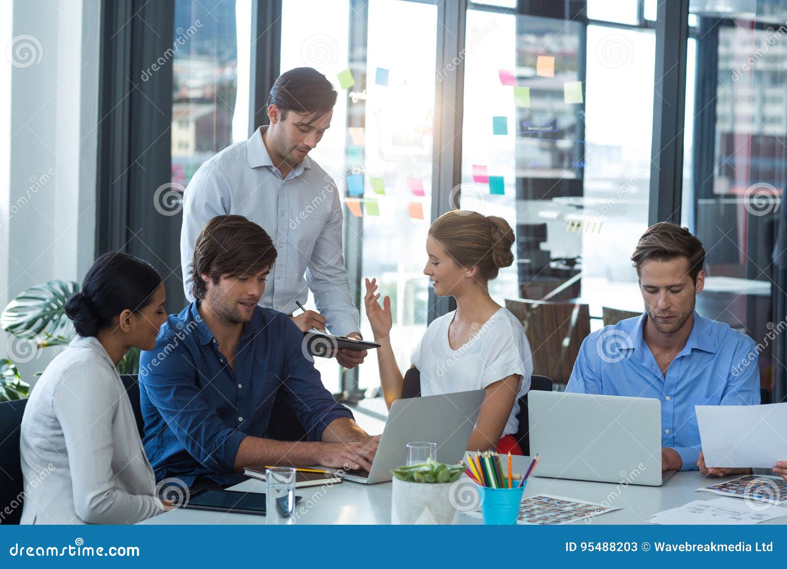 Team of Graphic Designers Interacting with Each Other Stock Image ...