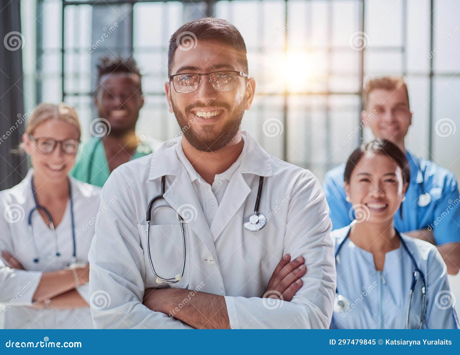 Successful Team of Medical Doctors are Looking at Camera and Smiling ...