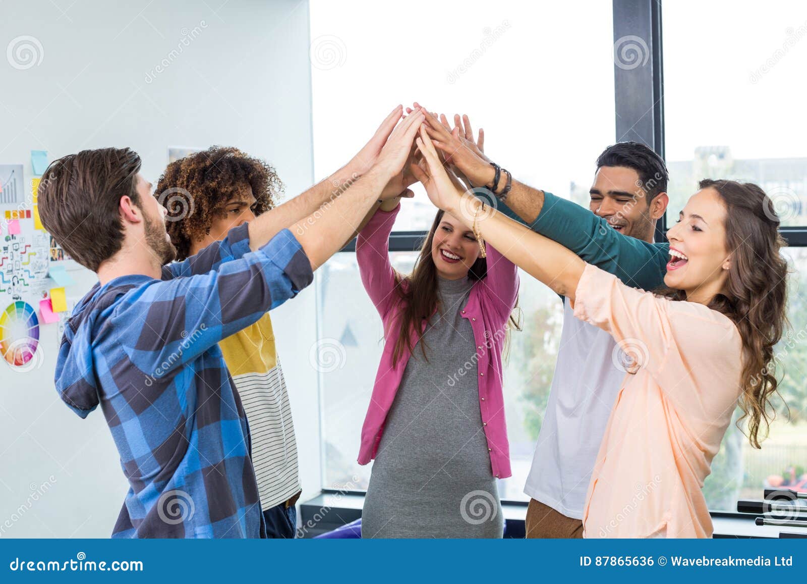 Team of Happy Graphic Designers Giving High Five Stock Photo - Image of ...