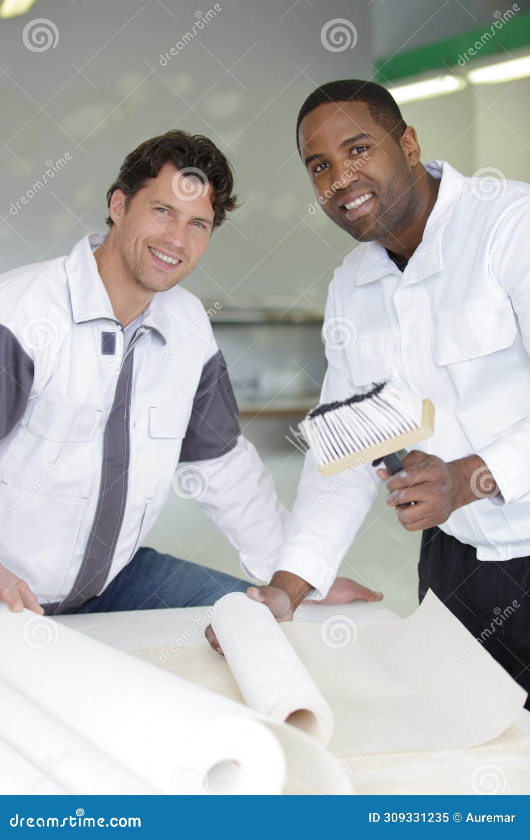 Team Happy Painters Smiling at Camera Stock Image - Image of showing ...