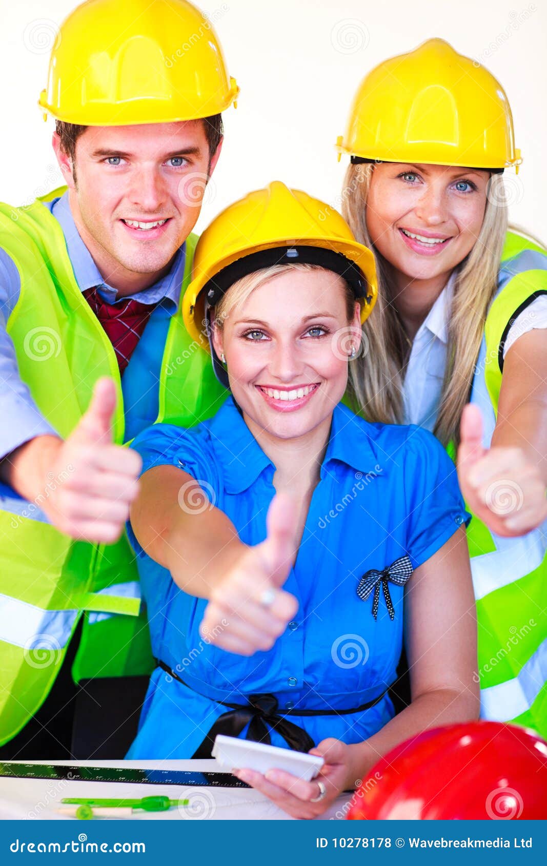 Team with Hard Hats Looking at the Camera Stock Photo - Image of ...