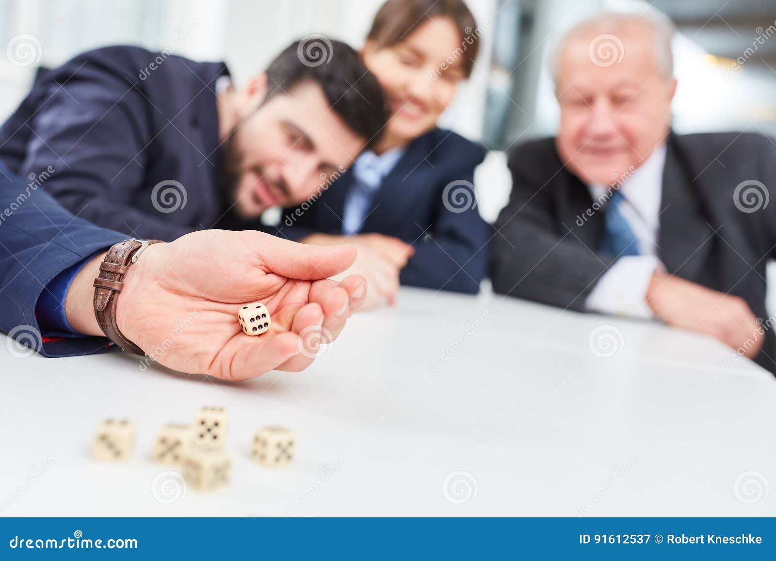 Team Having Fun Playing Dice Game Stock Image - Image of hands ...