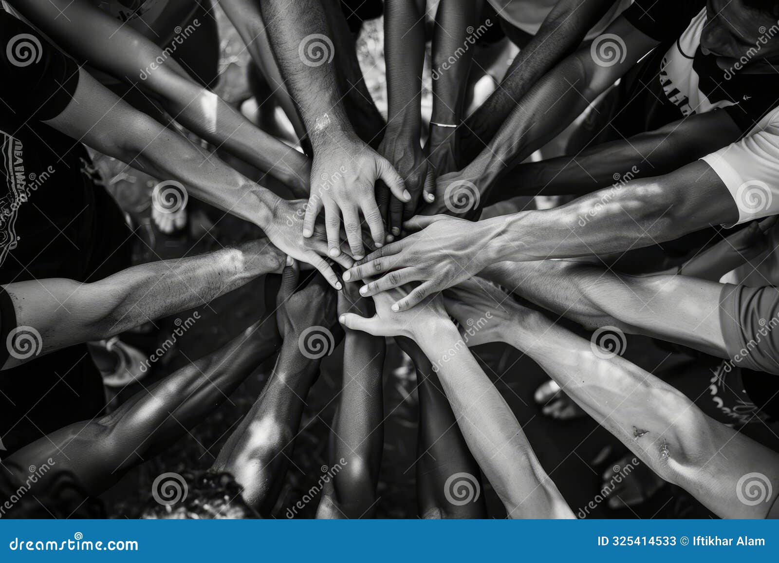 A Team of Individuals Huddles Together, Their Hands Clasped in a Symbol ...
