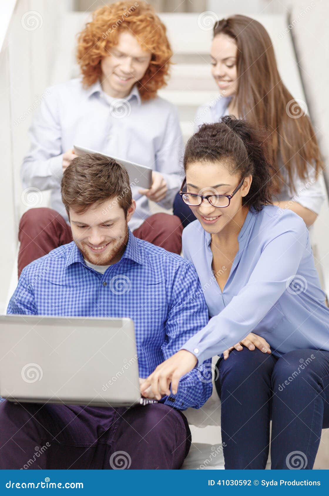 Team with Laptop and Tablet Pc on Staircase Stock Photo - Image of ...