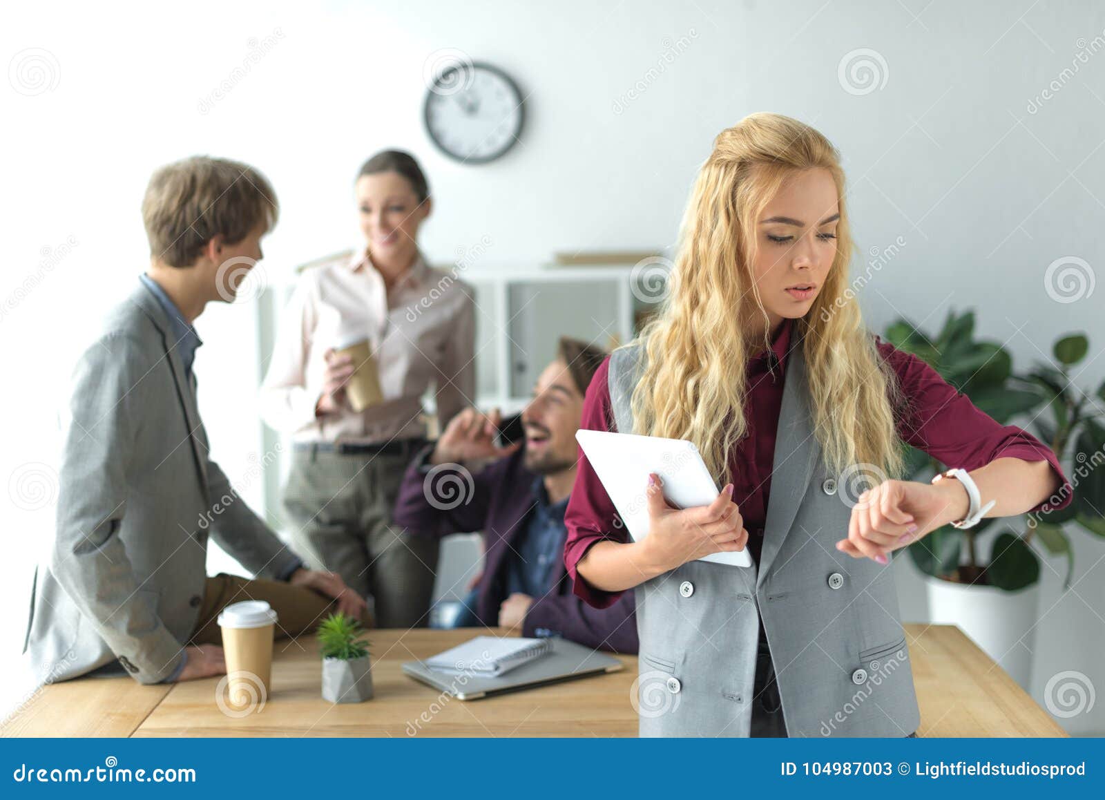 Team Leader Looking at Watch Stock Image - Image of electronics, team ...