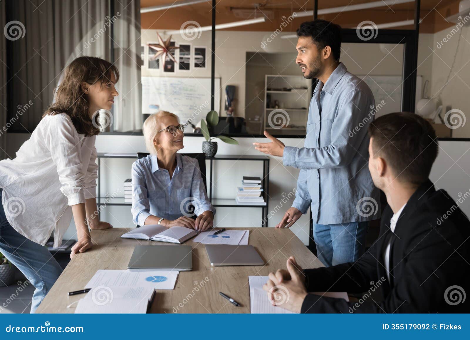 Team Leader Providing Information, Solution or Creative Ideas during Briefing Stock Photo ...