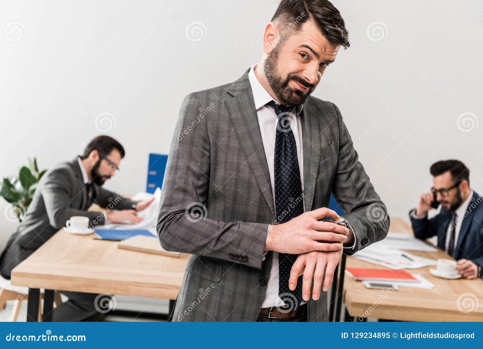 Team Leader Showing Time at Watch and Looking Stock Image - Image of ...